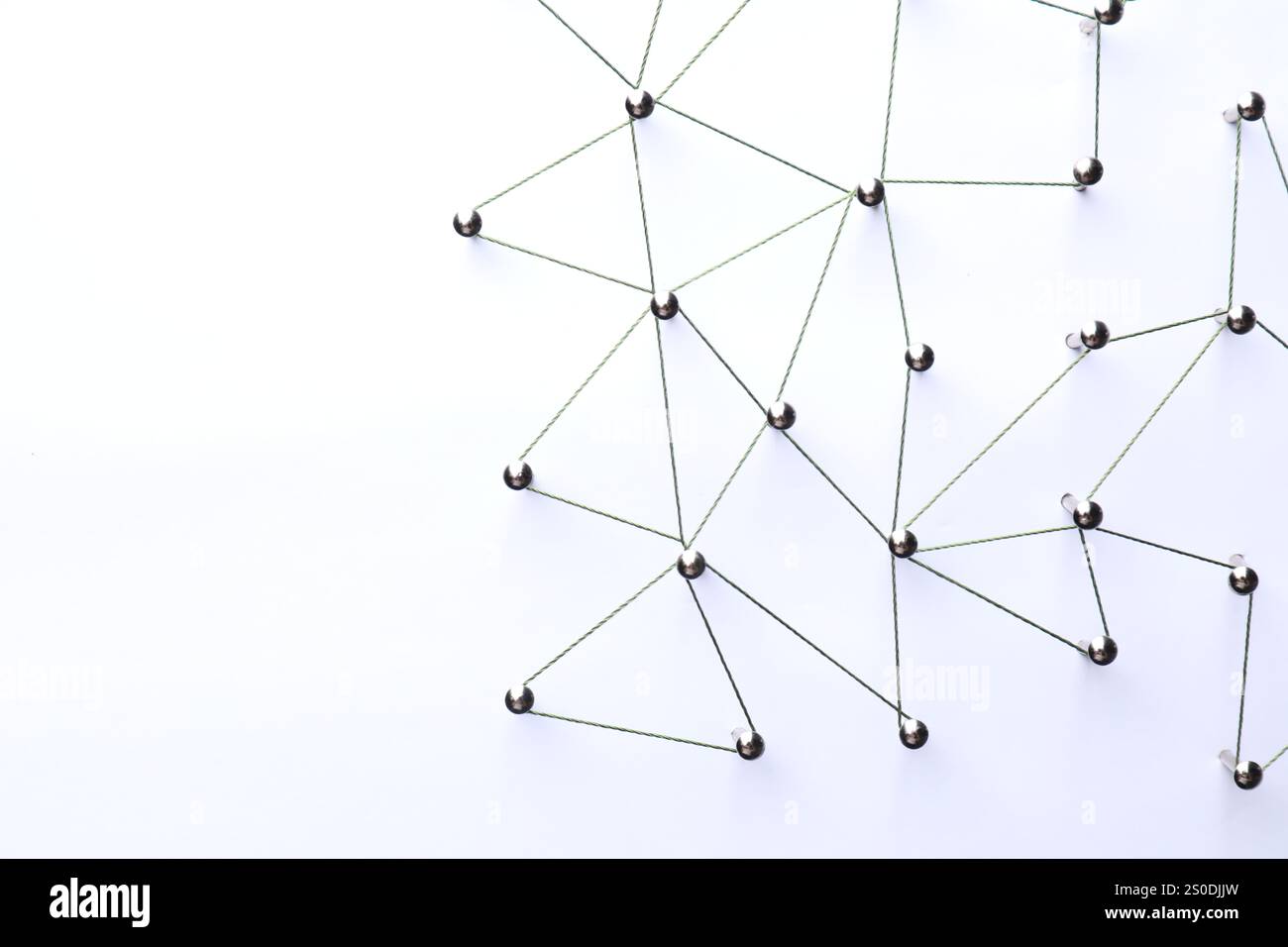 Network connection. Nails linked together by threads on white ...