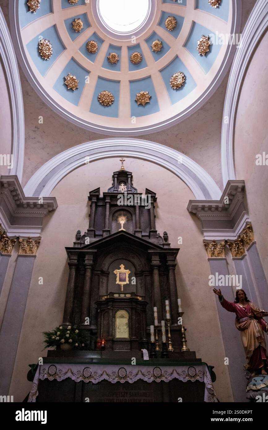 A church with a large dome and a small altar. The altar is decorated ...