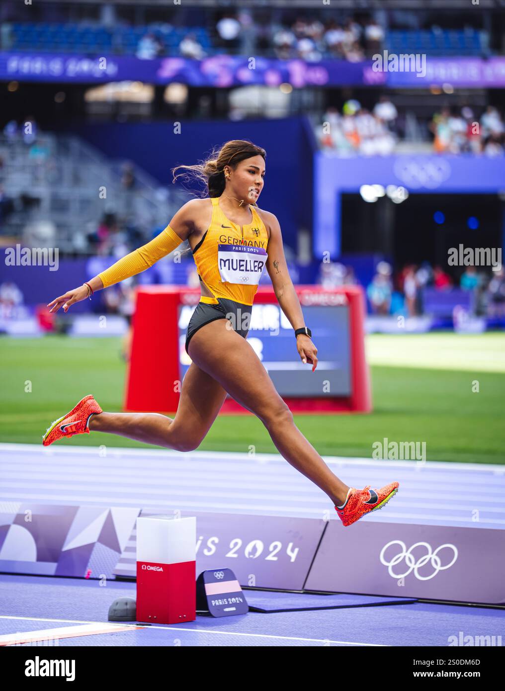 Mikaelle Assani participating in the long jump at the Paris 2024 ...