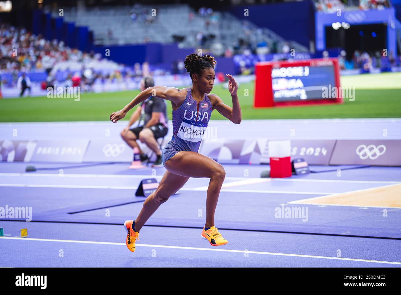Monae' Nichols participating in the long jump at the Paris 2024 Olympic ...