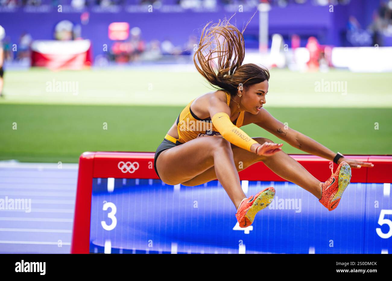 Mikaelle Assani participating in the long jump at the Paris 2024 ...