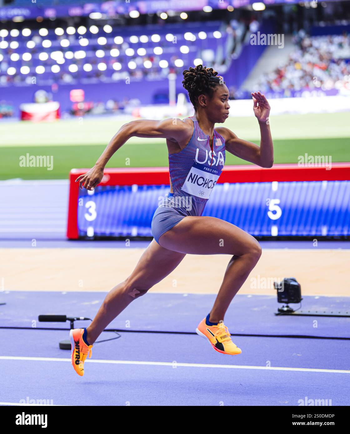 Monae' Nichols participating in the long jump at the Paris 2024 Olympic ...