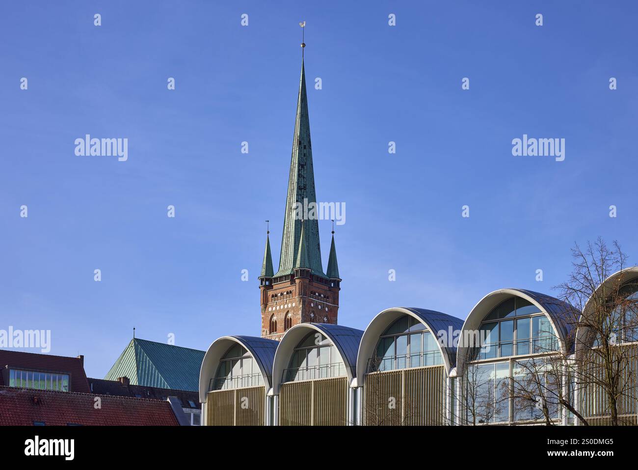 Church tower of St Peter's Church and modern architecture, Hanseatic ...