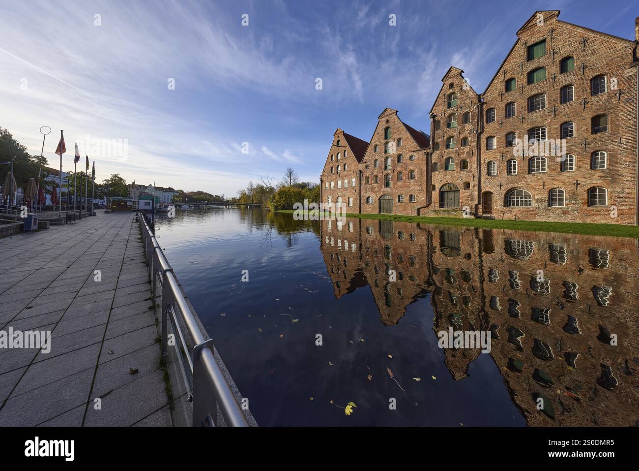 Historic salt warehouses, brick buildings reflected in the morning ...