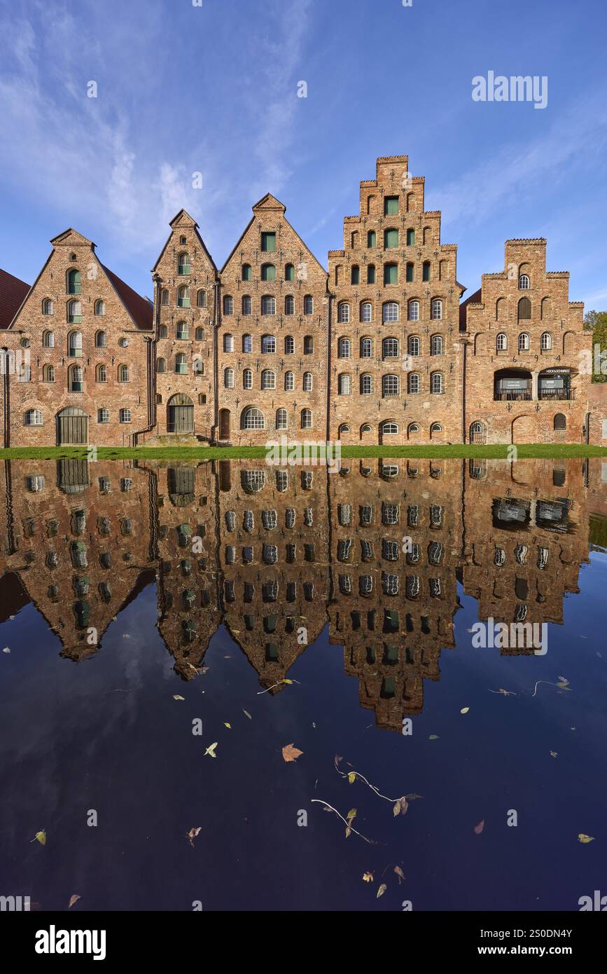 Historic salt warehouses, brick buildings reflected on the water ...