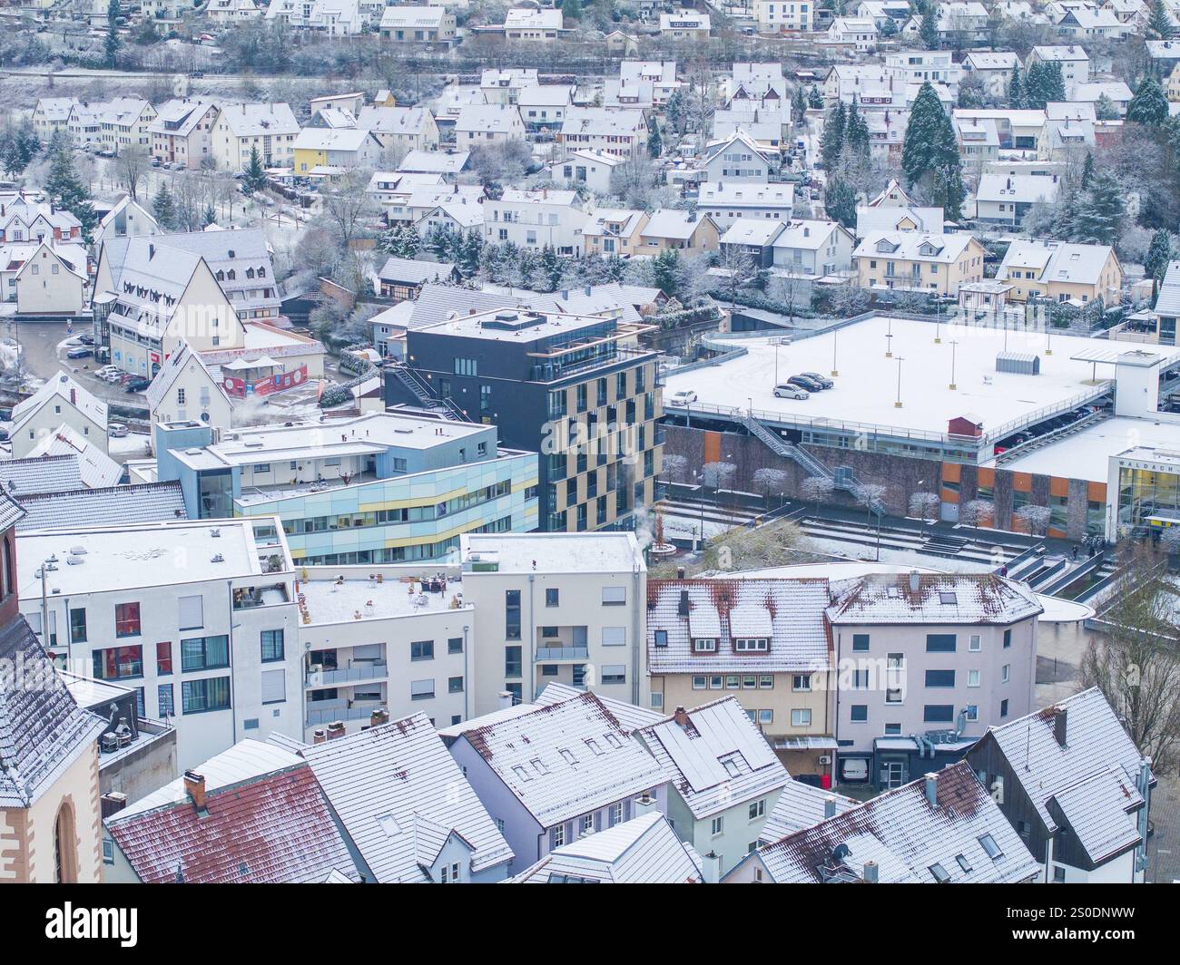 Overview of a snowy town with many houses and snow-covered roofs ...