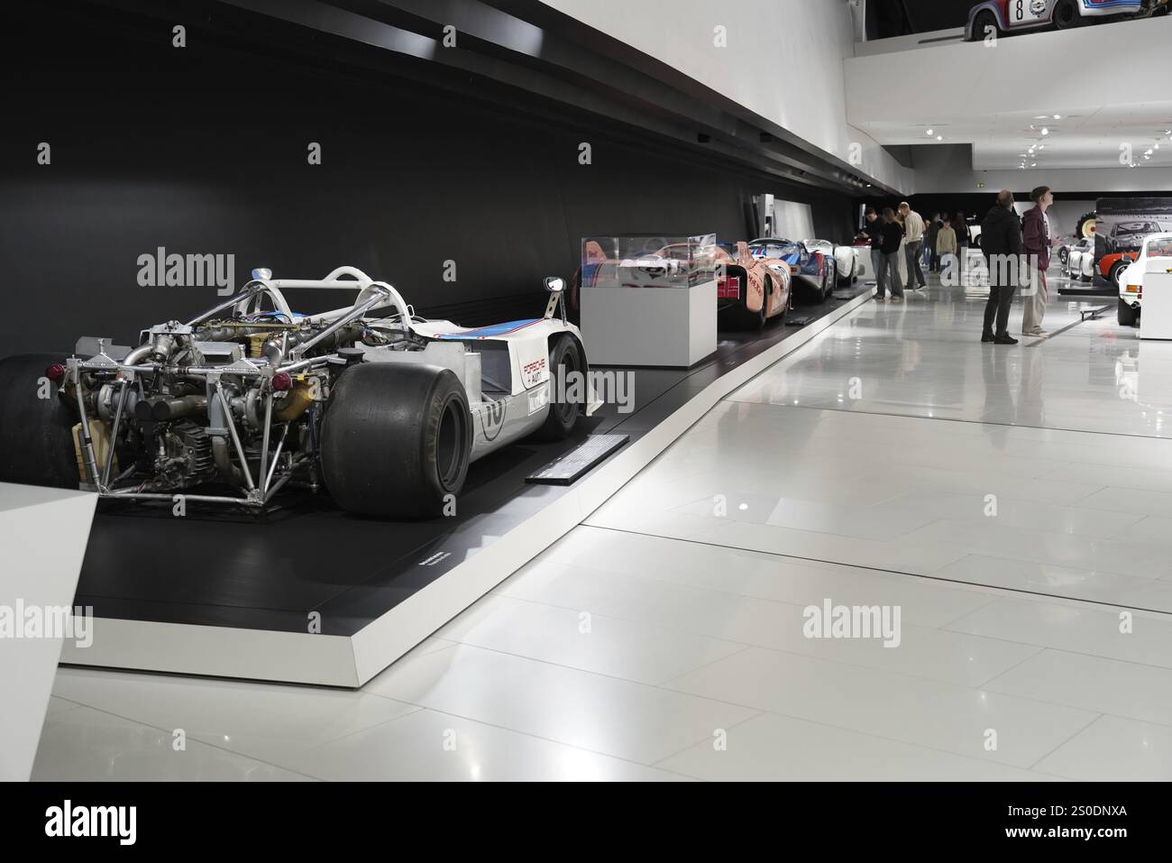 Various racing cars in a large exhibition hall of a car museum, New ...