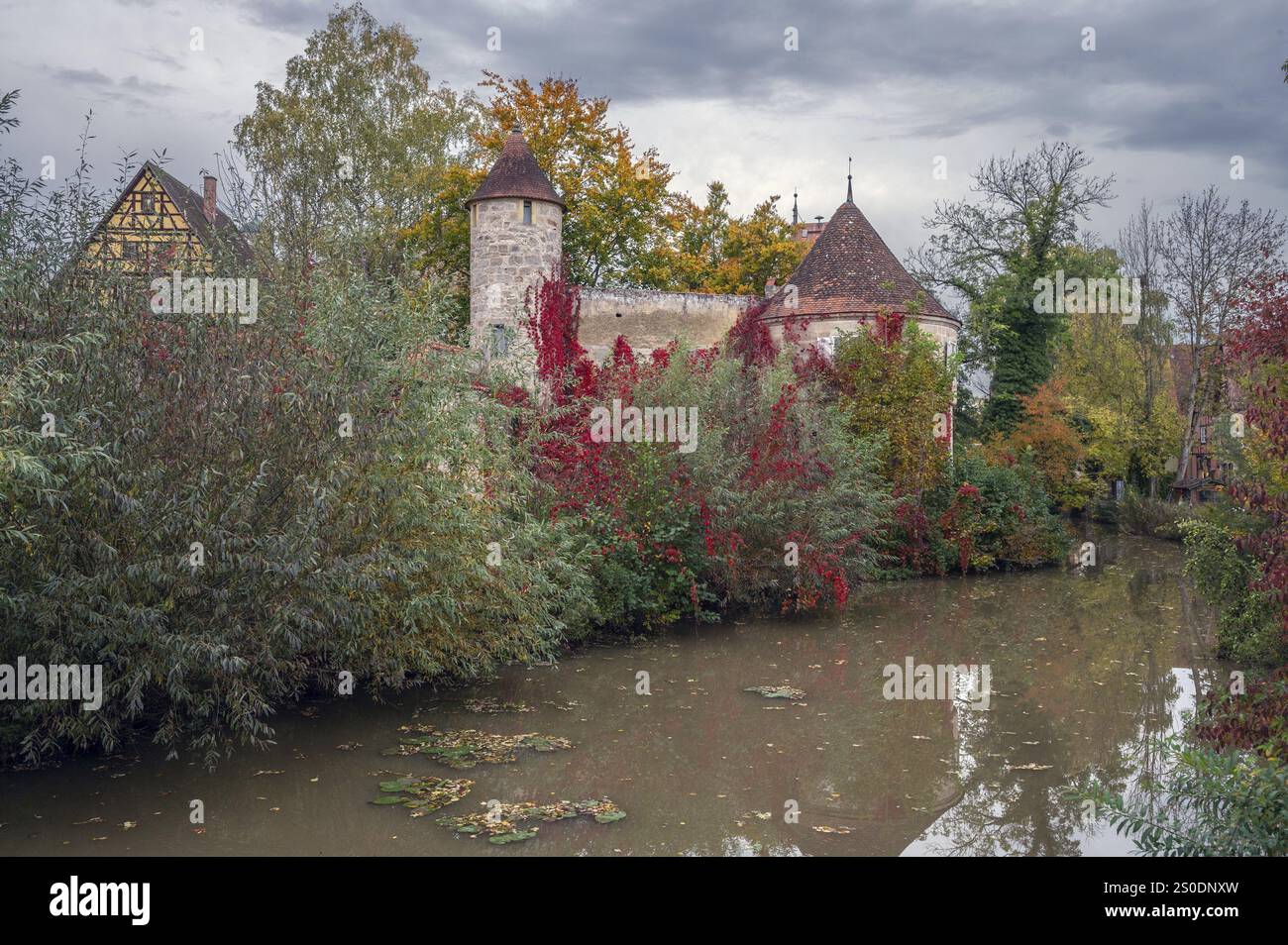 Towers of the medieval defence wall around 1200, in front the Woernitz ...