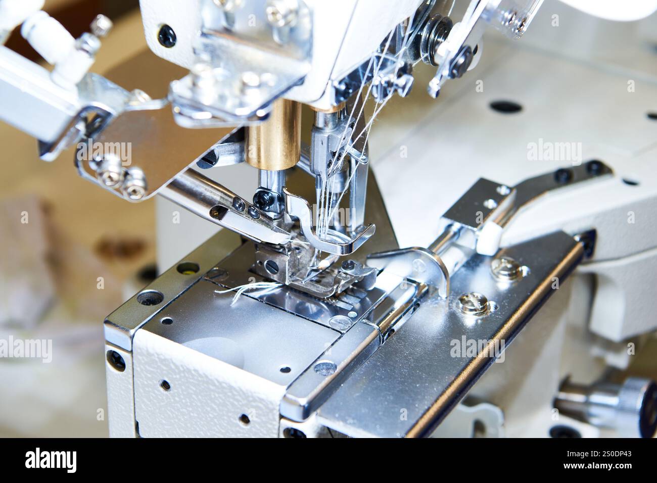 Sewing machine metal foot and needles Stock Photo - Alamy
