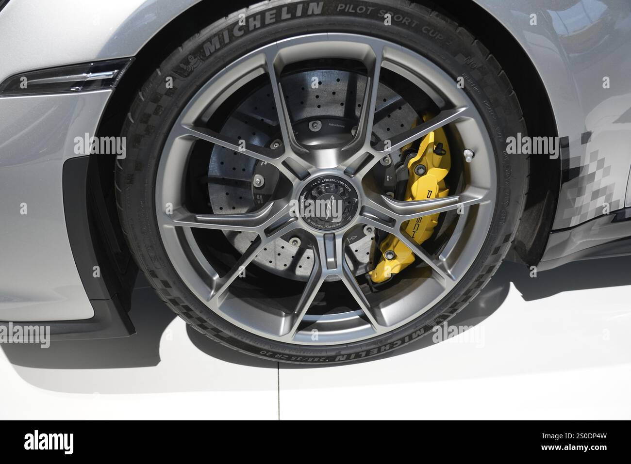 Porsche 911 GT3, close-up of a Porsche tyre with silver rim and yellow ...