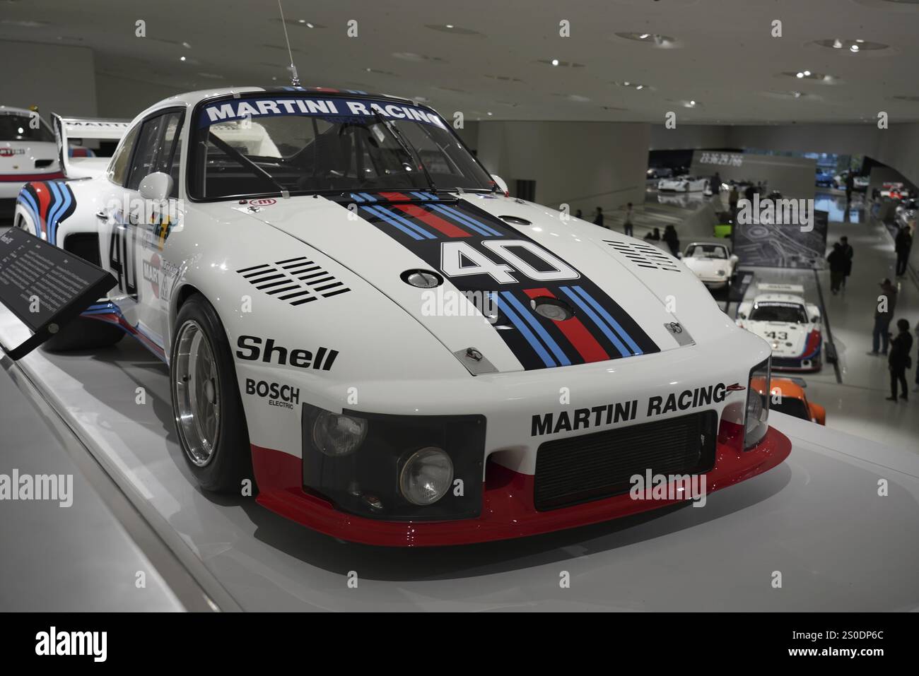 Front view of a Porsche racing car in Martini design with stripes ...