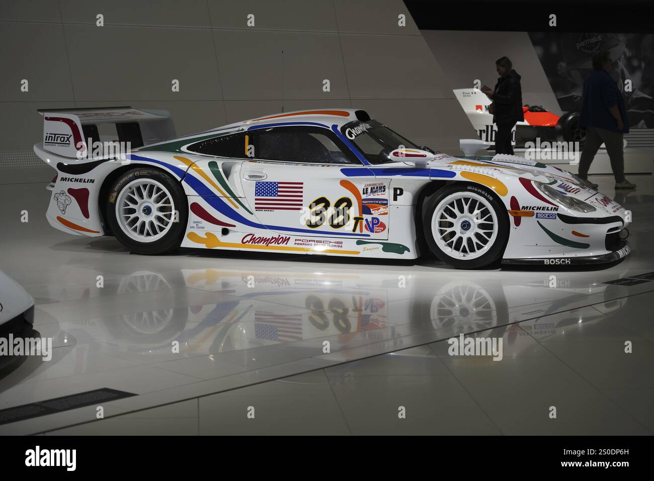 Colourful racing car with number 38 presented in an exhibition room ...