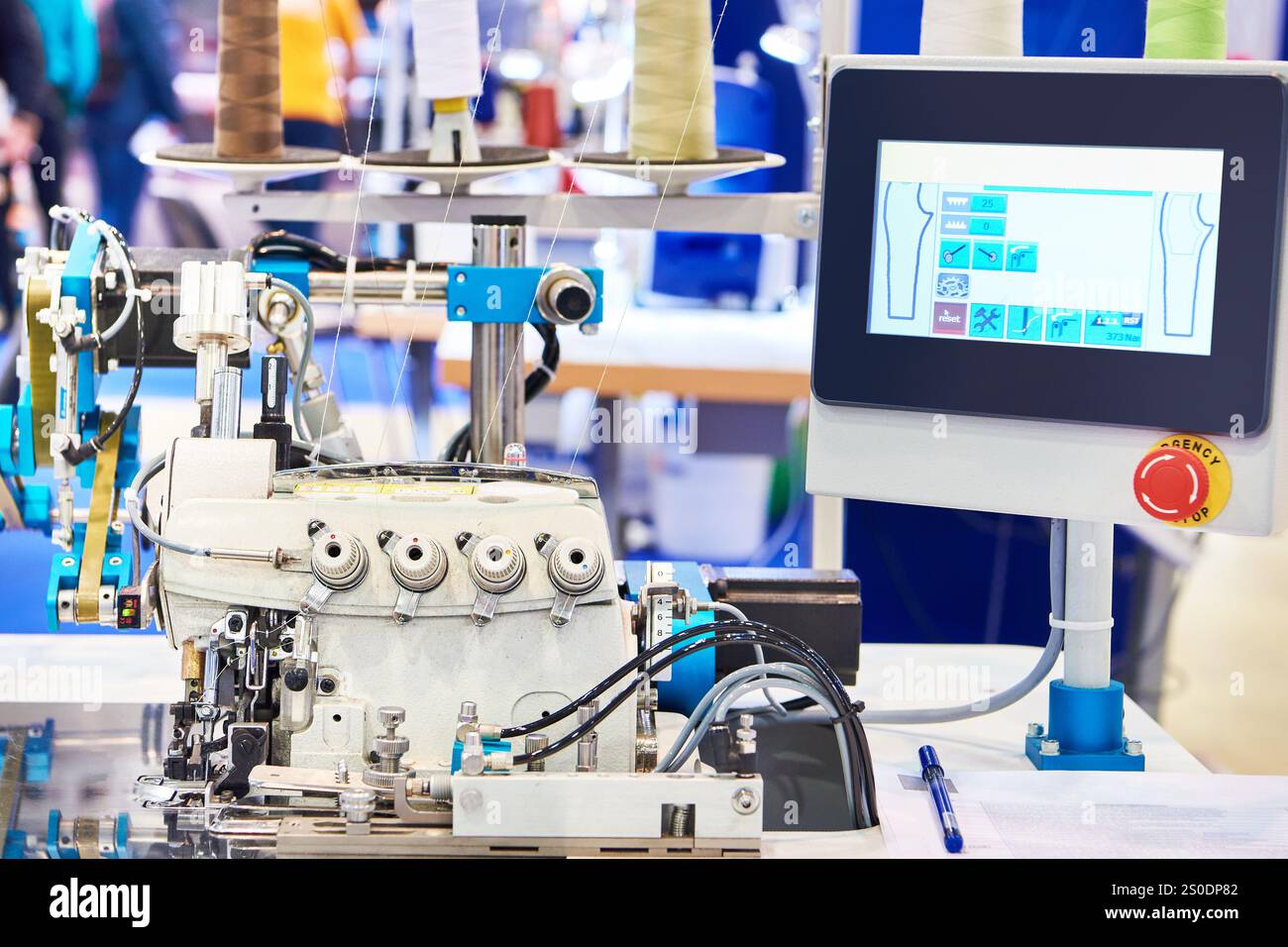 High-speed variable top-feed overlock safety stitch machine Stock Photo ...