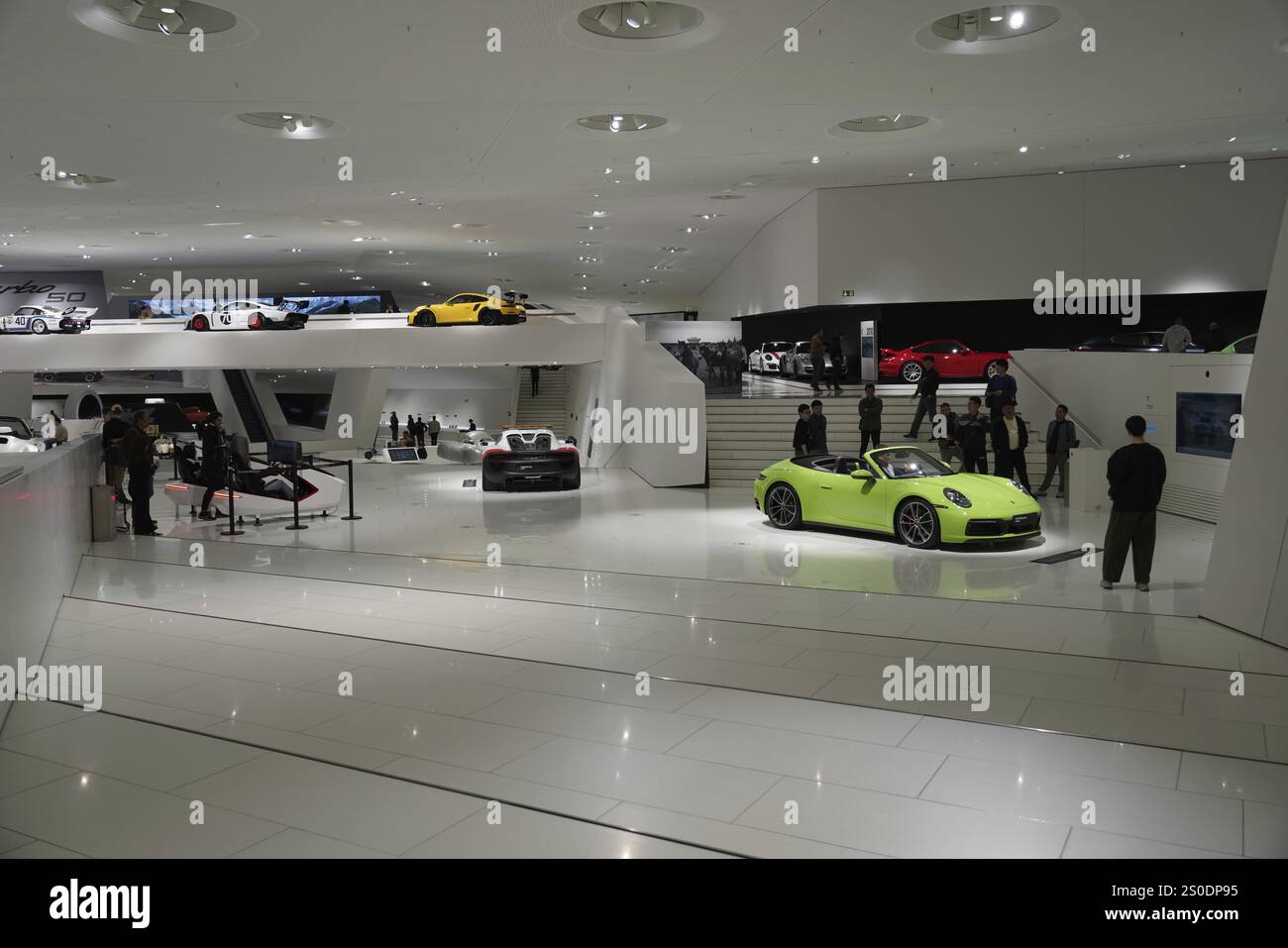Interior view of a car museum with various sports cars on display, New ...