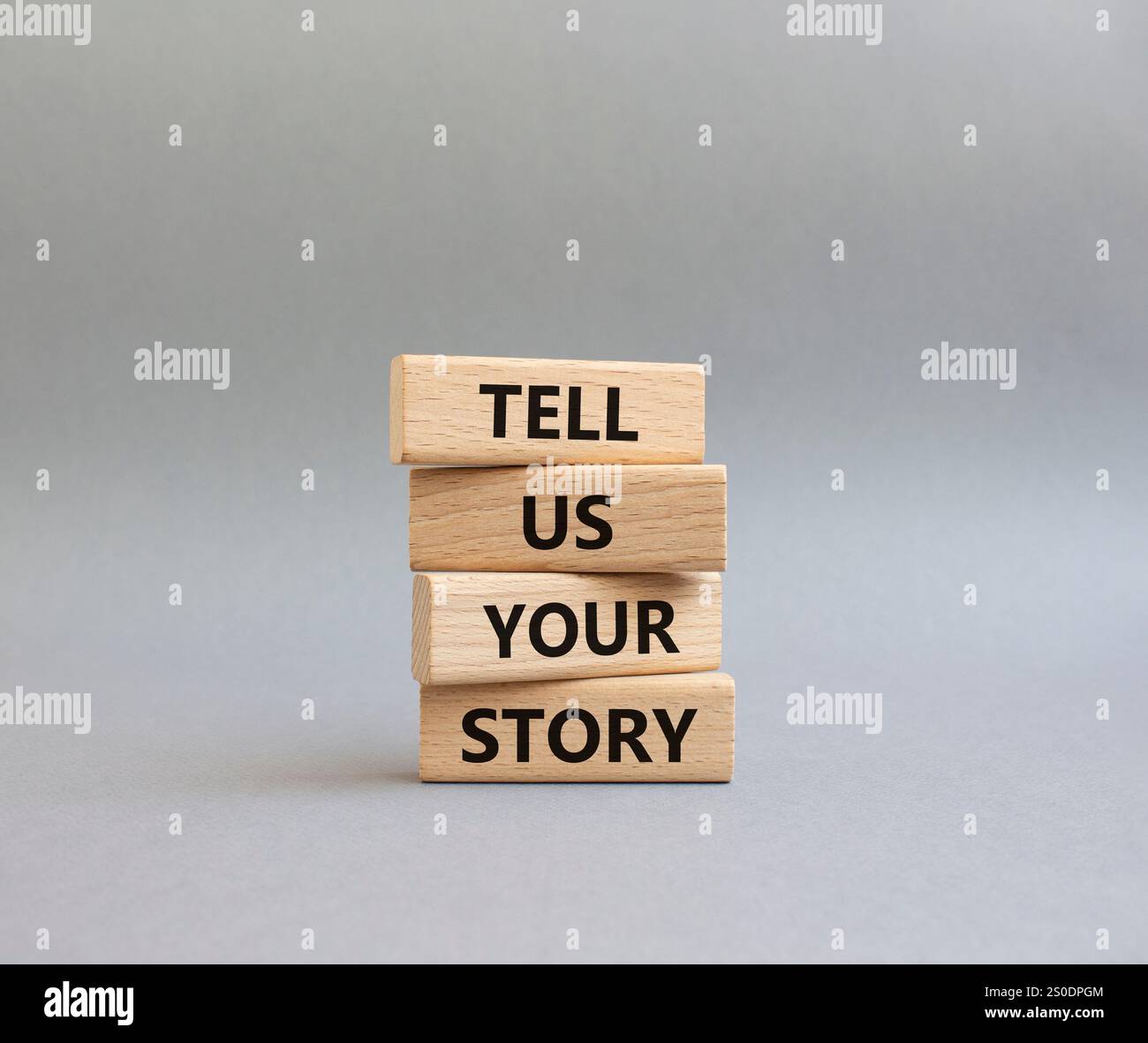 Tell us your story symbol. Concept words Tell us your story on wooden ...