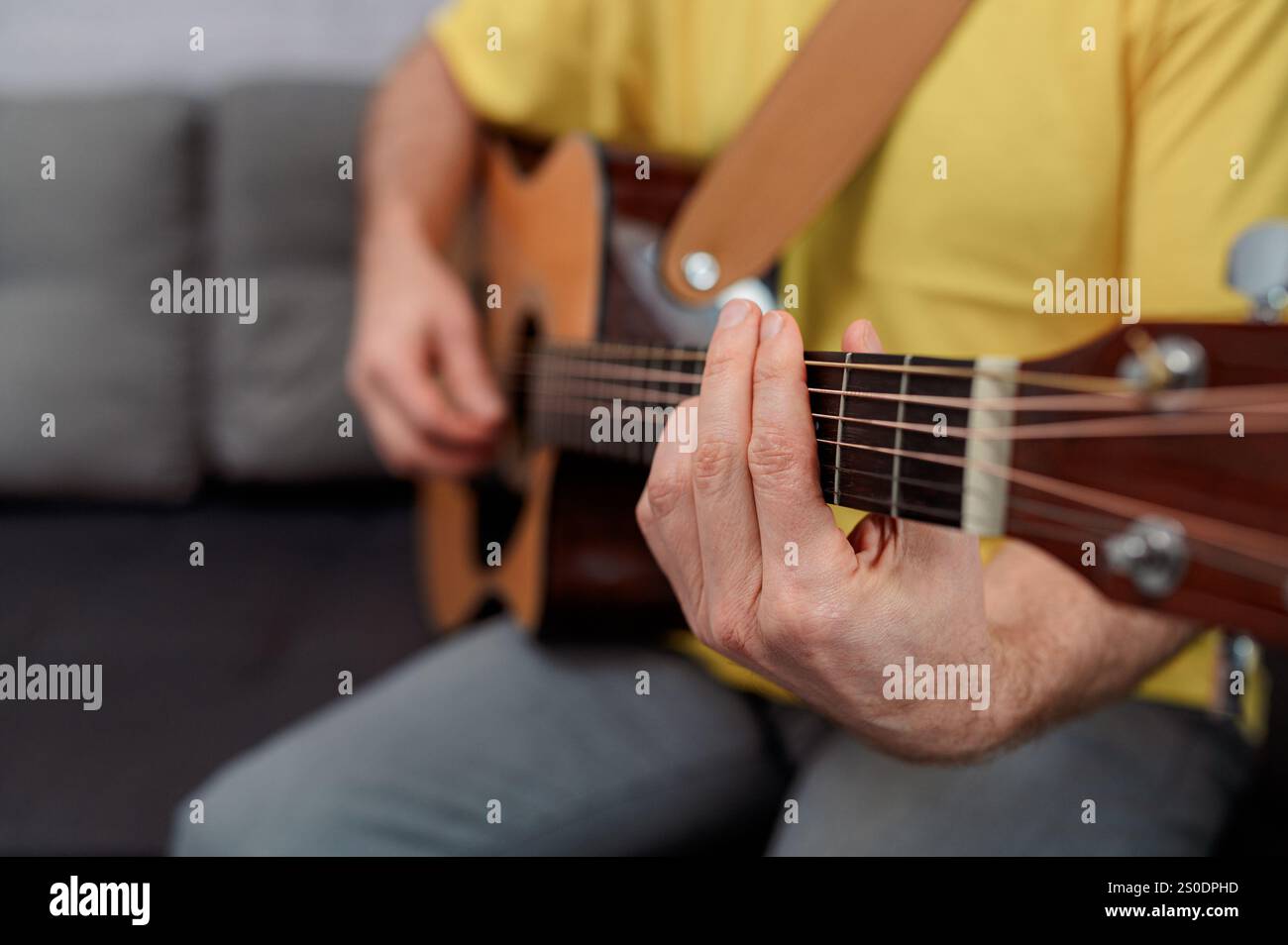 Silhouette of guitarist paying a acoustic guitar against window. Man ...