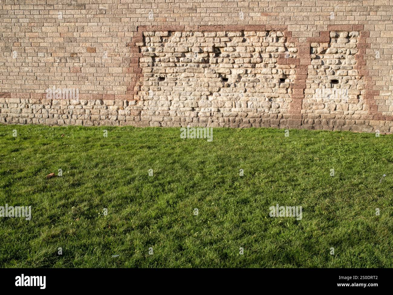 Parts of the original Roman fort beneath the red stones on the southern ...