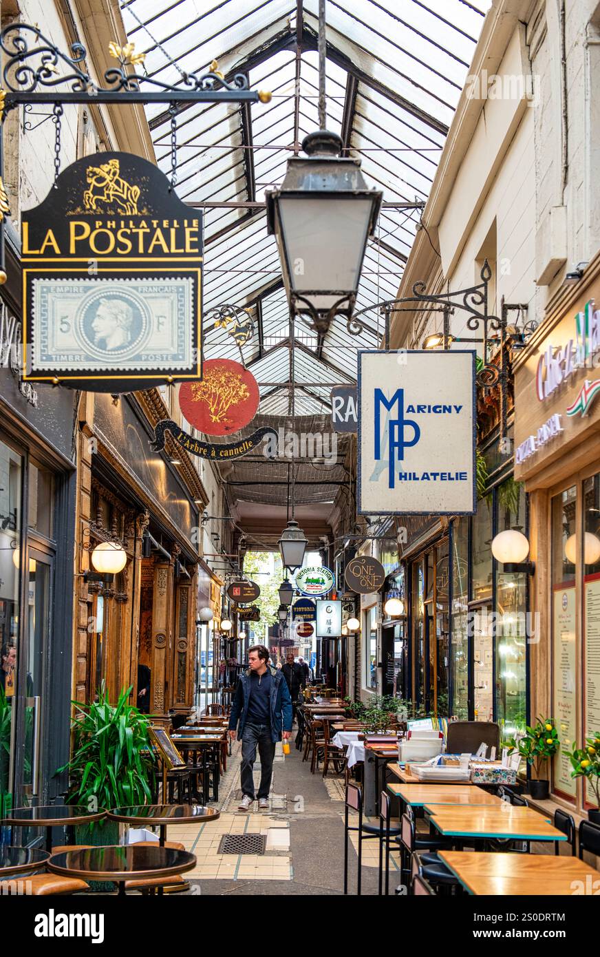 Passage des Panoramas. A group of boutique stores in an arcade in Paris ...