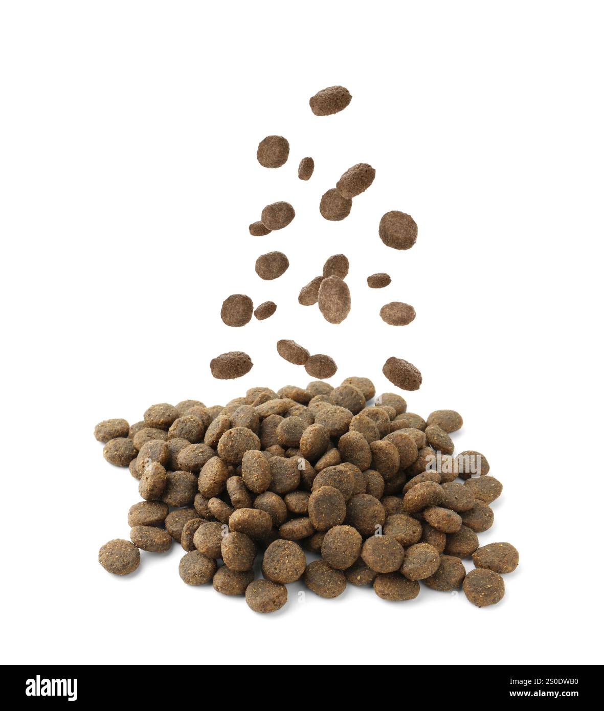 Dry pet food falling onto heap on white background Stock Photo - Alamy