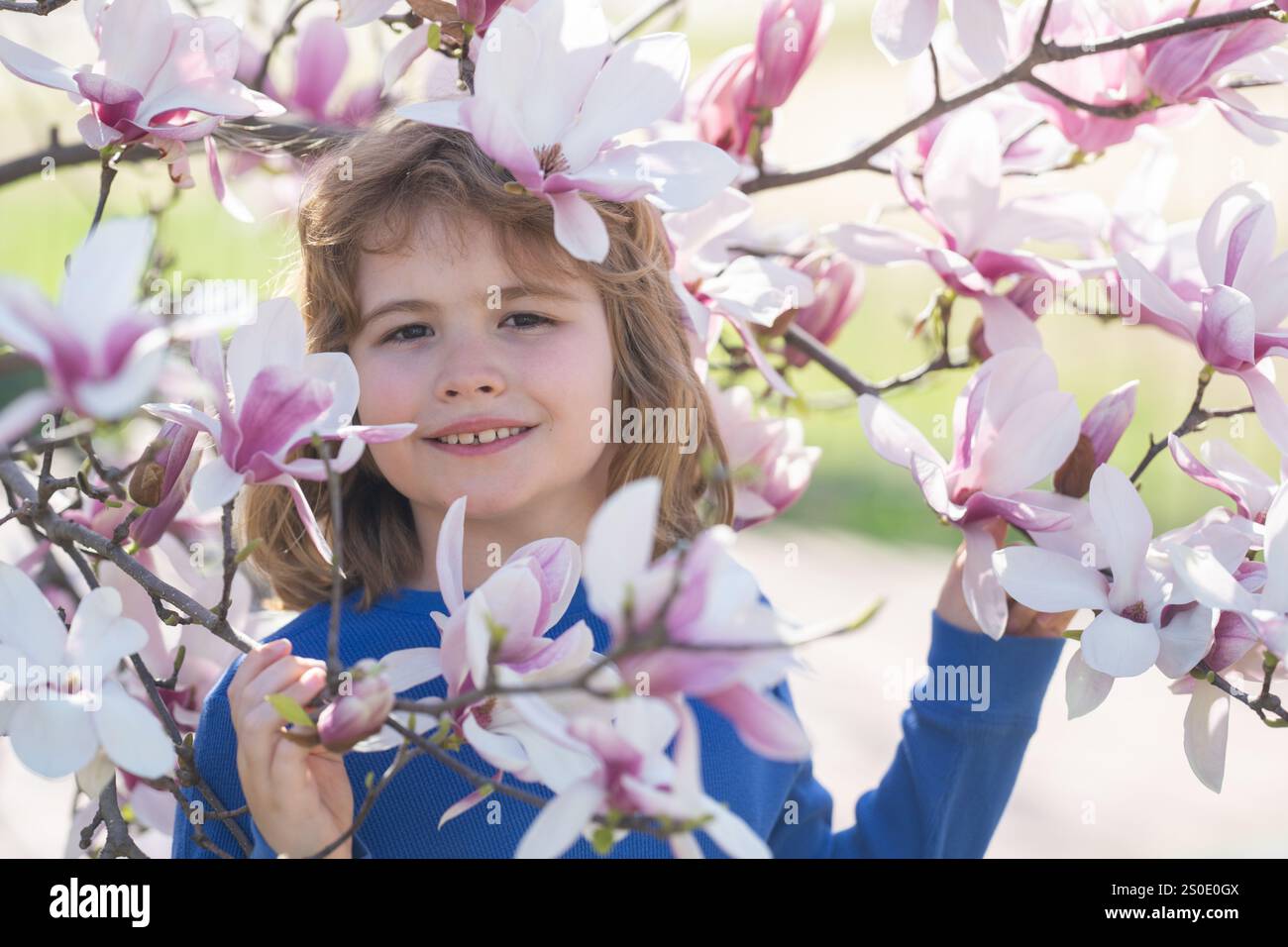 Spring fun for kids. Child play outdoors in a beautiful spring garden ...