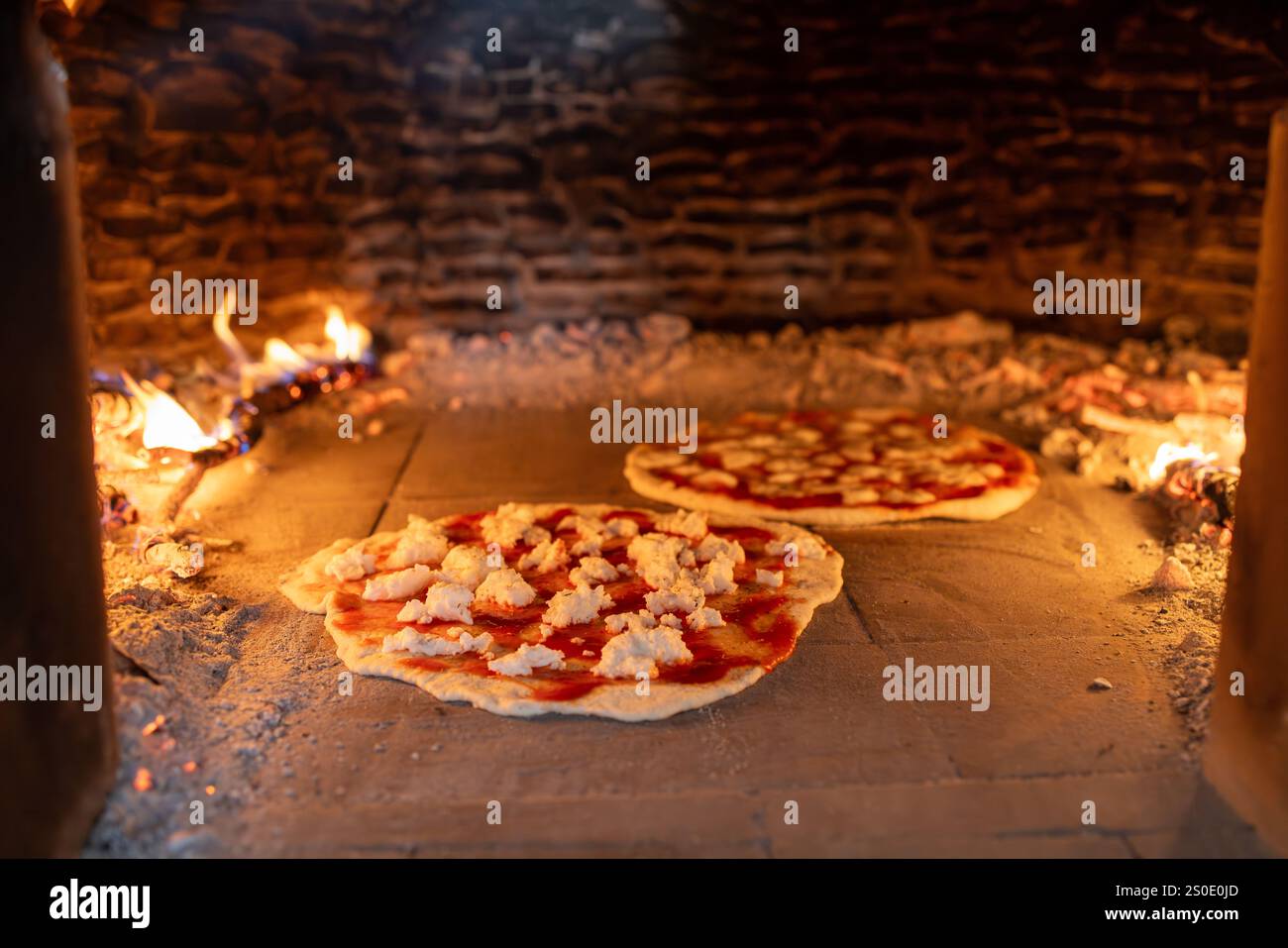 Authentic Pizzas Baking in an Italian Wood-Fired Oven Stock Photo - Alamy