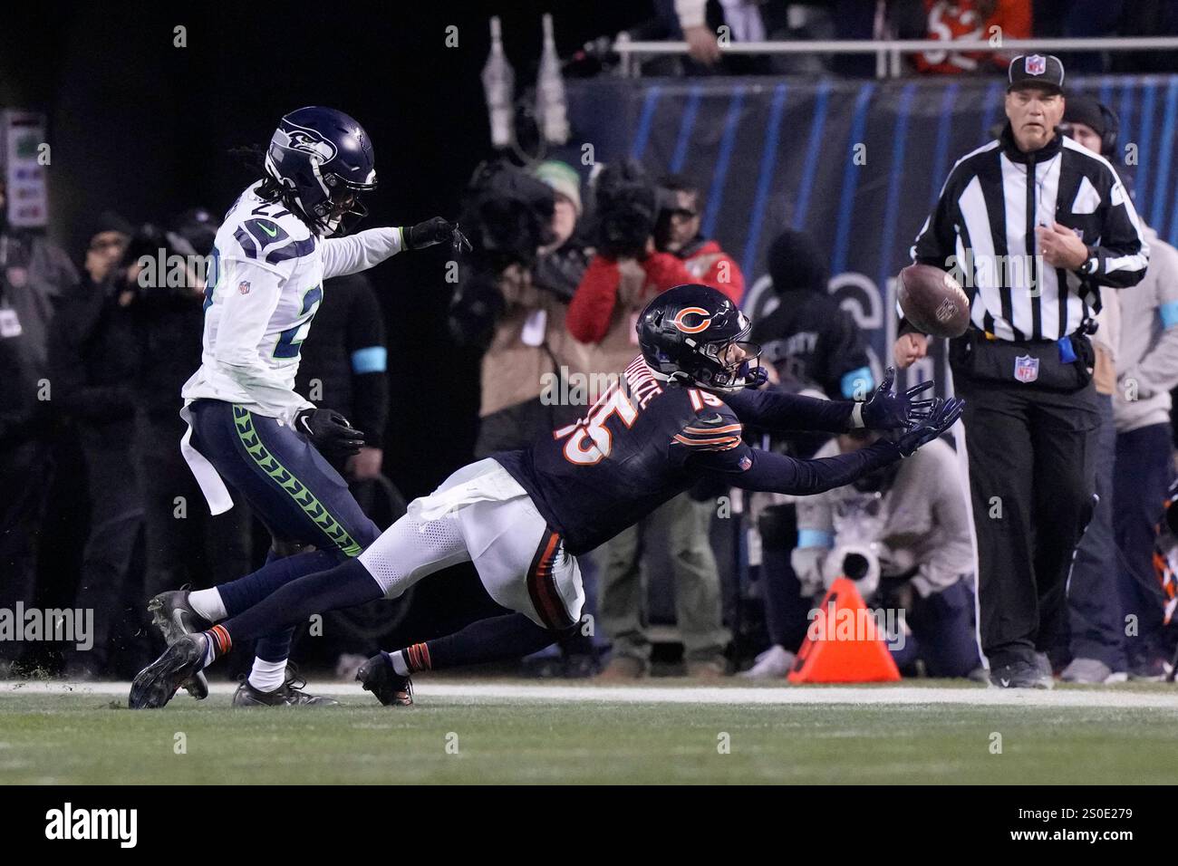Chicago Bears wide receiver Rome Odunze, right, can't make the catch a ...
