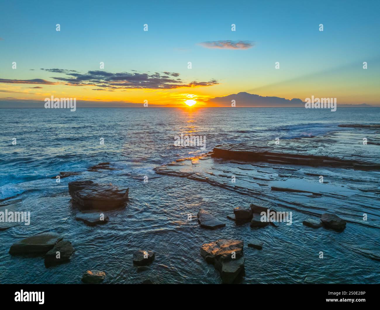 Aerial sunrise seascape with clouds from The Skillion in Terrigal, NSW ...