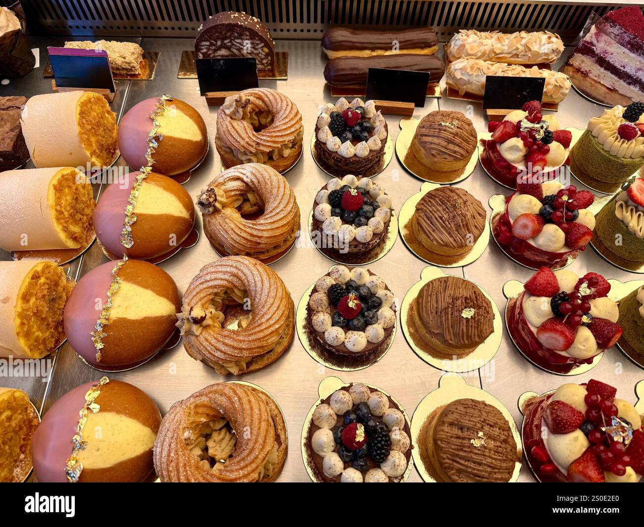 Types of cakes. Delicious cakes in bulk at the patisserie counter. For ...