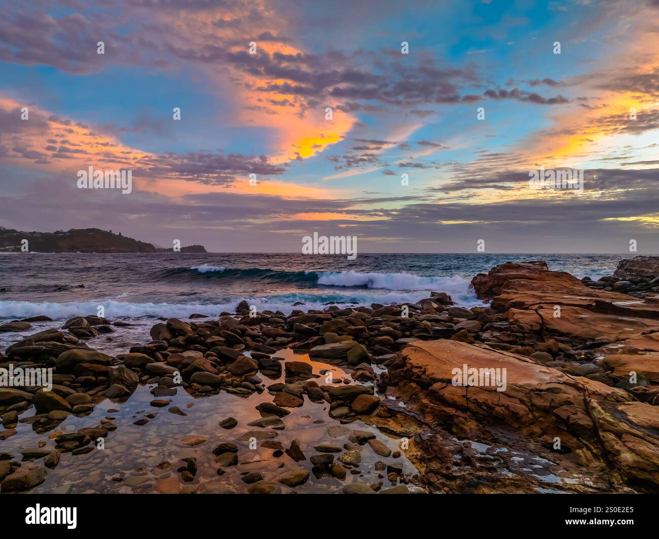 Sunrise seascape with clouds at Avoca Beach on the Central Coast, NSW ...