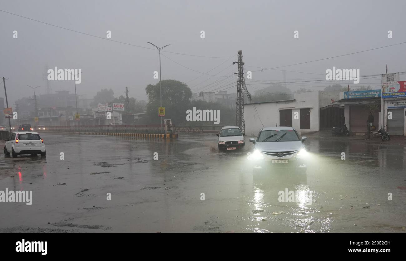 Beawar, Rajasthan, India, December 27, 2024: Vehicles wade through ...