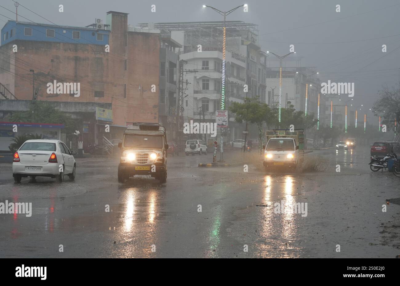 Beawar, Rajasthan, India, December 27, 2024: Vehicles wade through ...