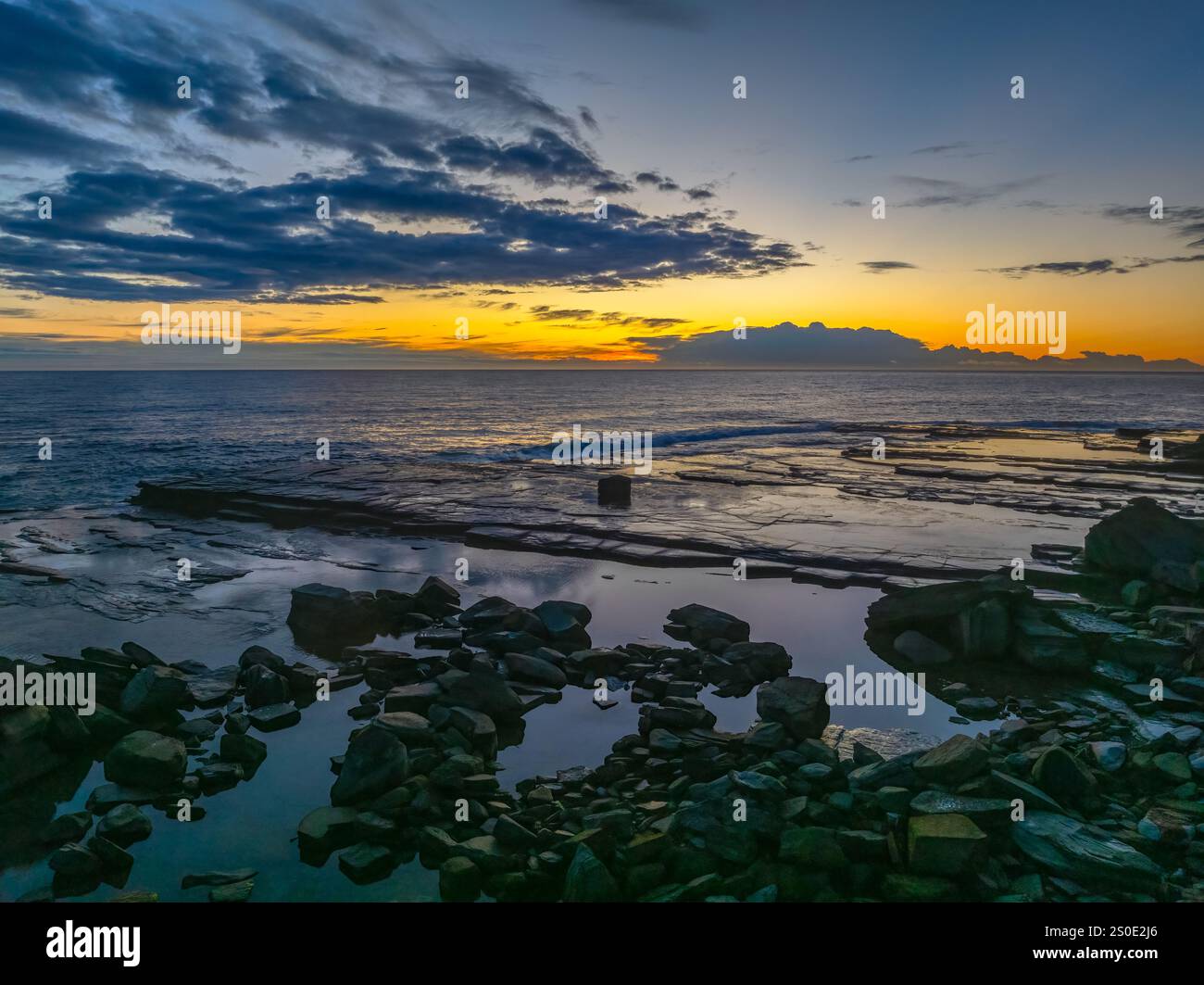 Aerial sunrise seascape with clouds from The Skillion in Terrigal, NSW ...