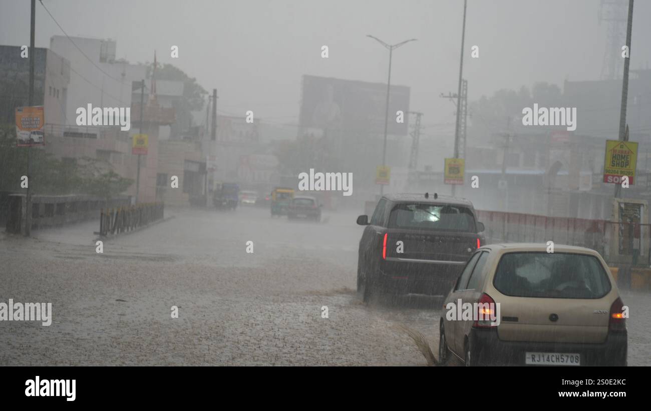 Beawar, Rajasthan, India, December 27, 2024: Vehicles wade through ...