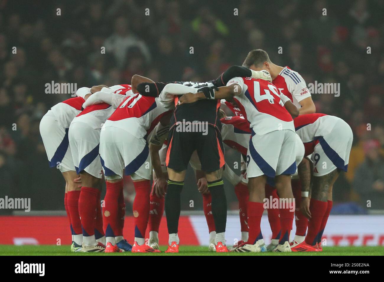 Arsenal players form a huddle during the Premier League match Arsenal ...