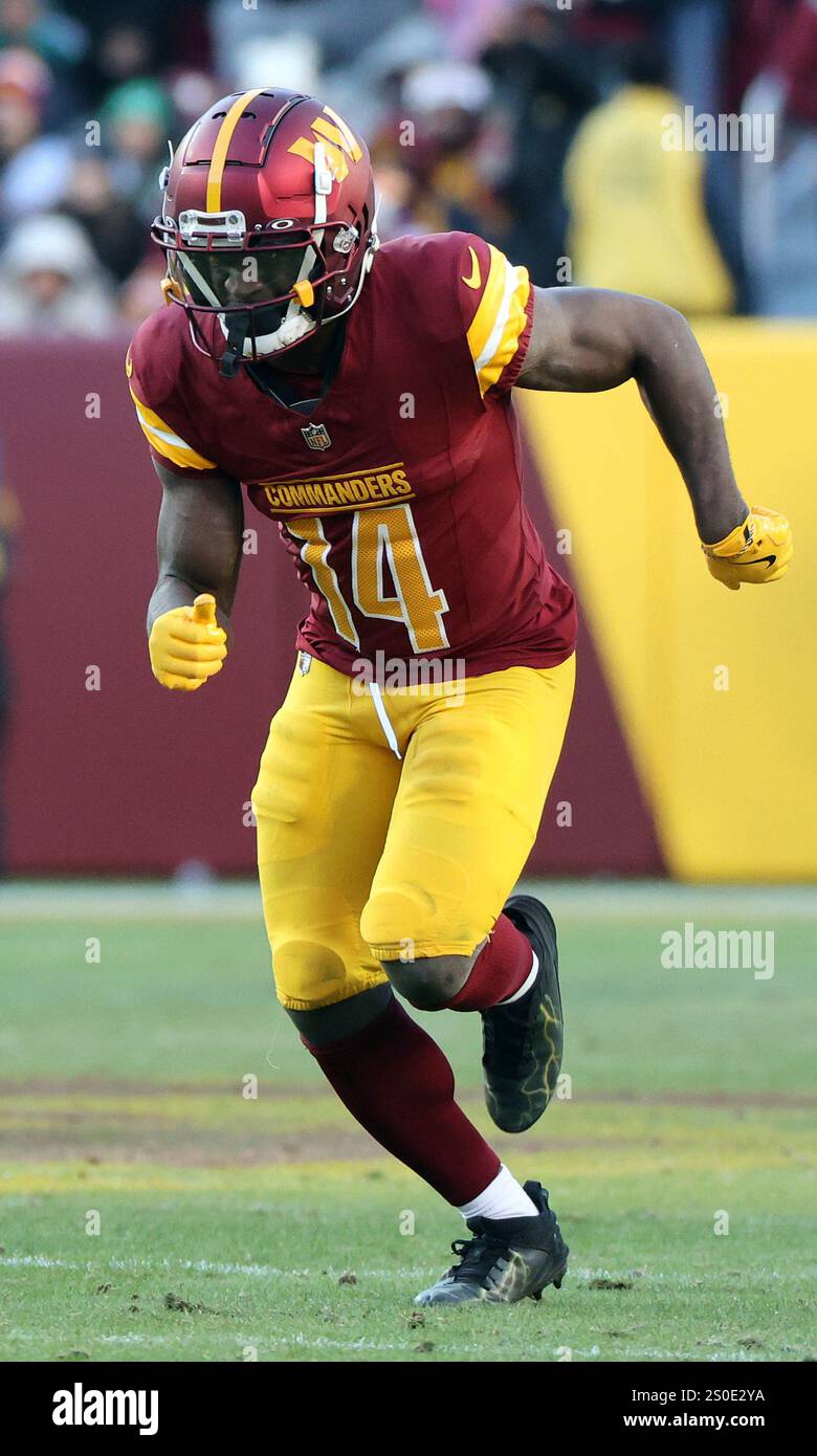 Washington Commanders wide receiver Olamide Zaccheaus (14) runs a route ...