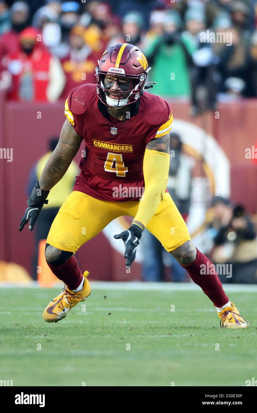 Washington Commanders linebacker Frankie Luvu (4) rushes during an NFL ...