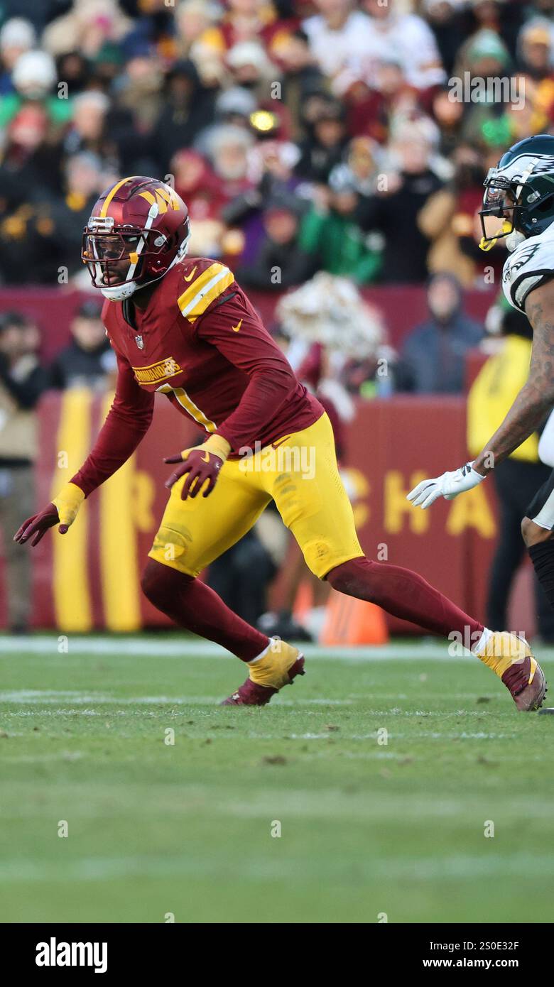 Washington Commanders cornerback Noah Igbinoghene (1) rushes during an ...