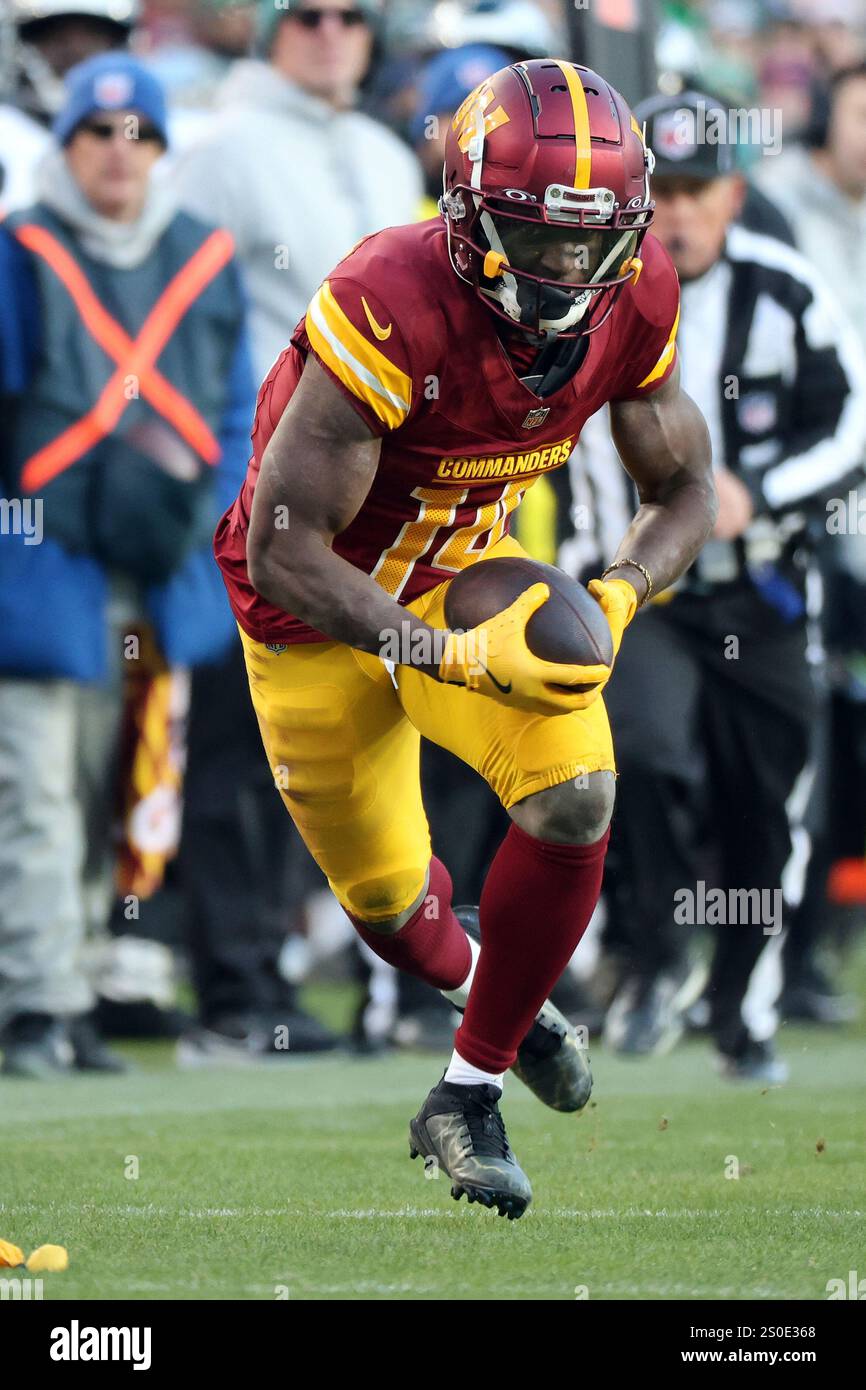 Washington Commanders wide receiver Olamide Zaccheaus (14) runs with ...