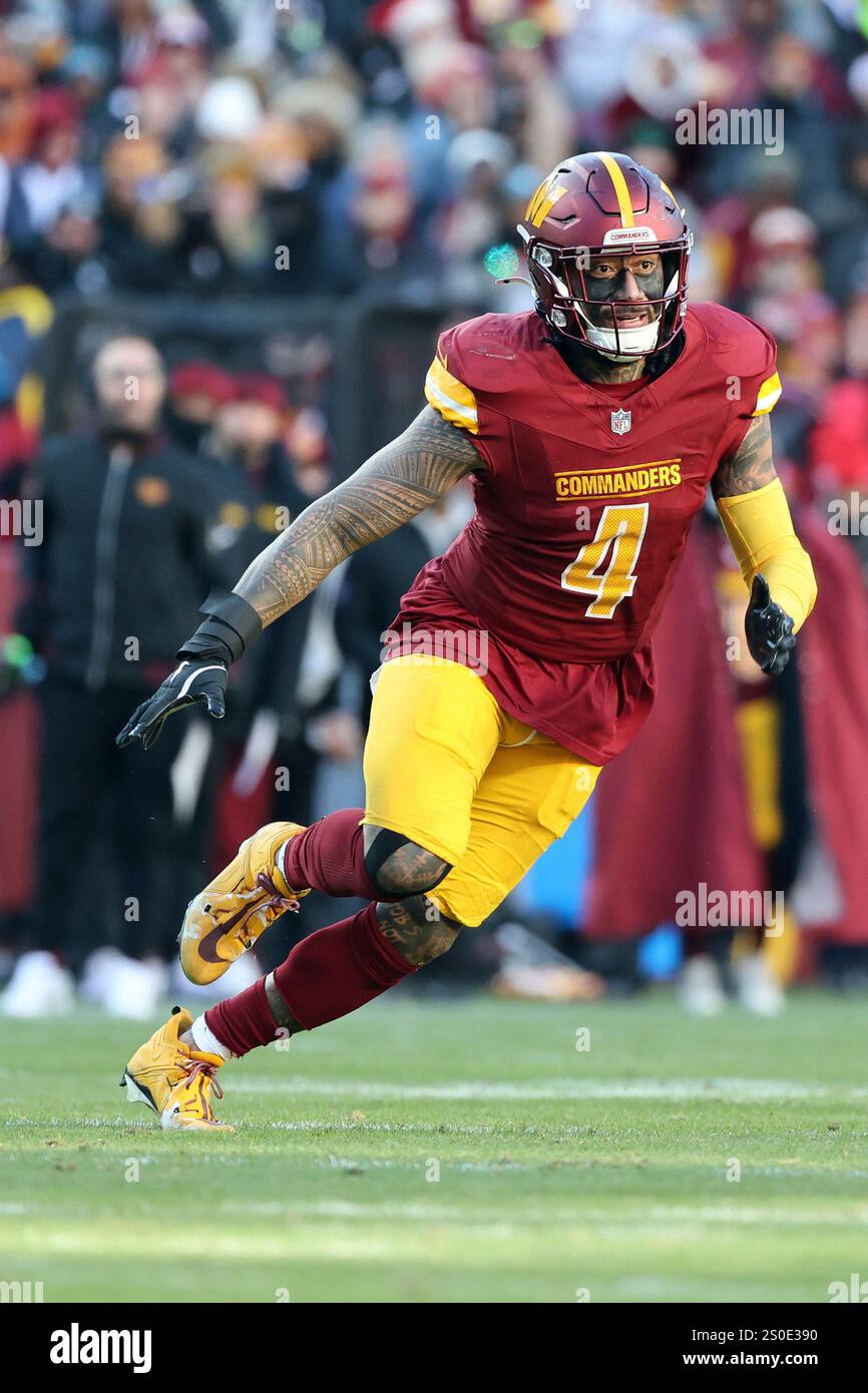 Washington Commanders linebacker Frankie Luvu (4) rushes during an NFL ...