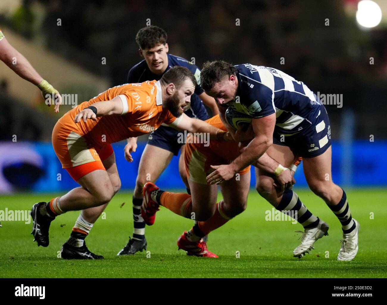 Bristol Bears' Max Lahiff (right) is tackled by Sale Sharks' Luke Cowan ...