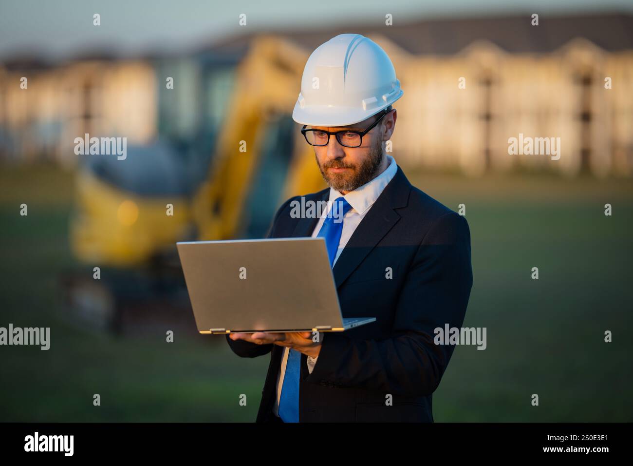 Civil engineer worker at a construction site. Mature engineer worker ...