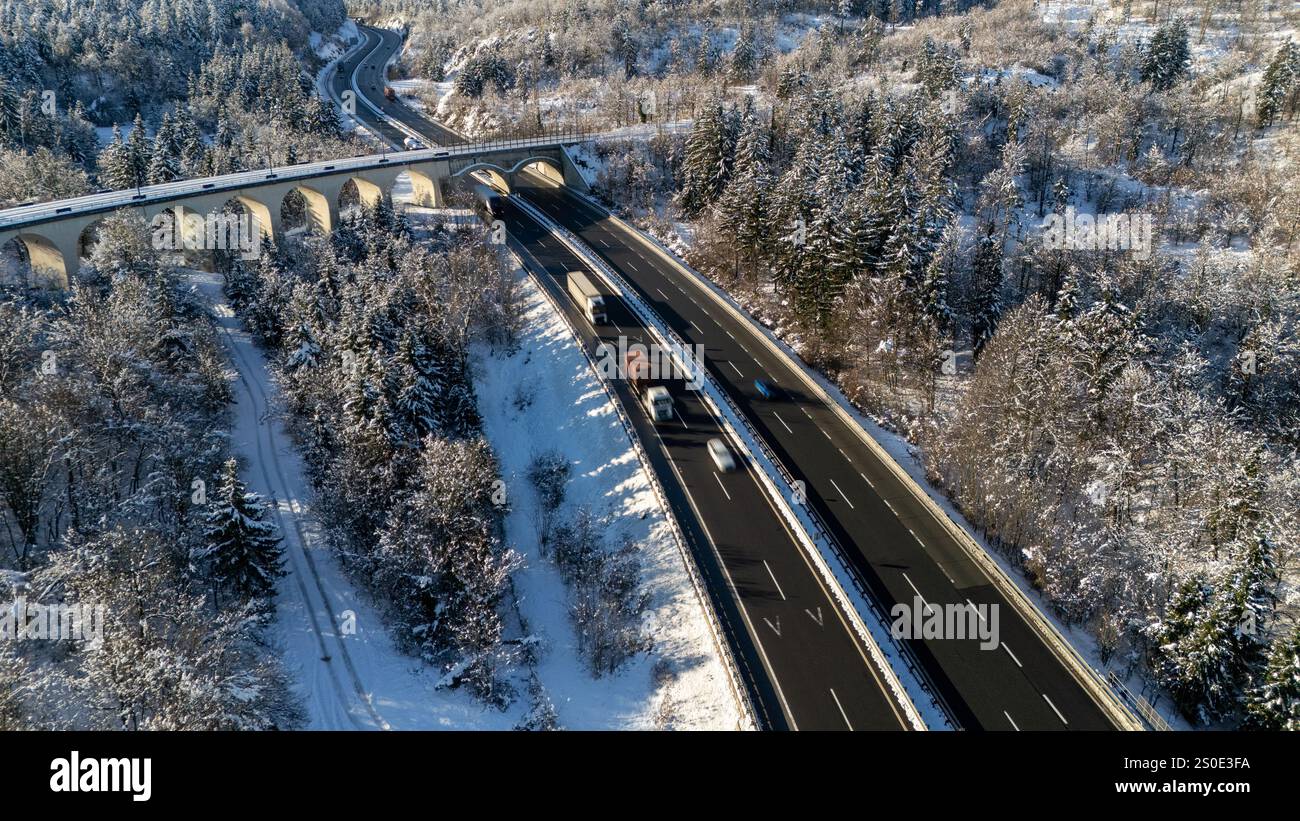 Aerial View of a Snowy Highway and Bridge in Winter Stock Photo - Alamy