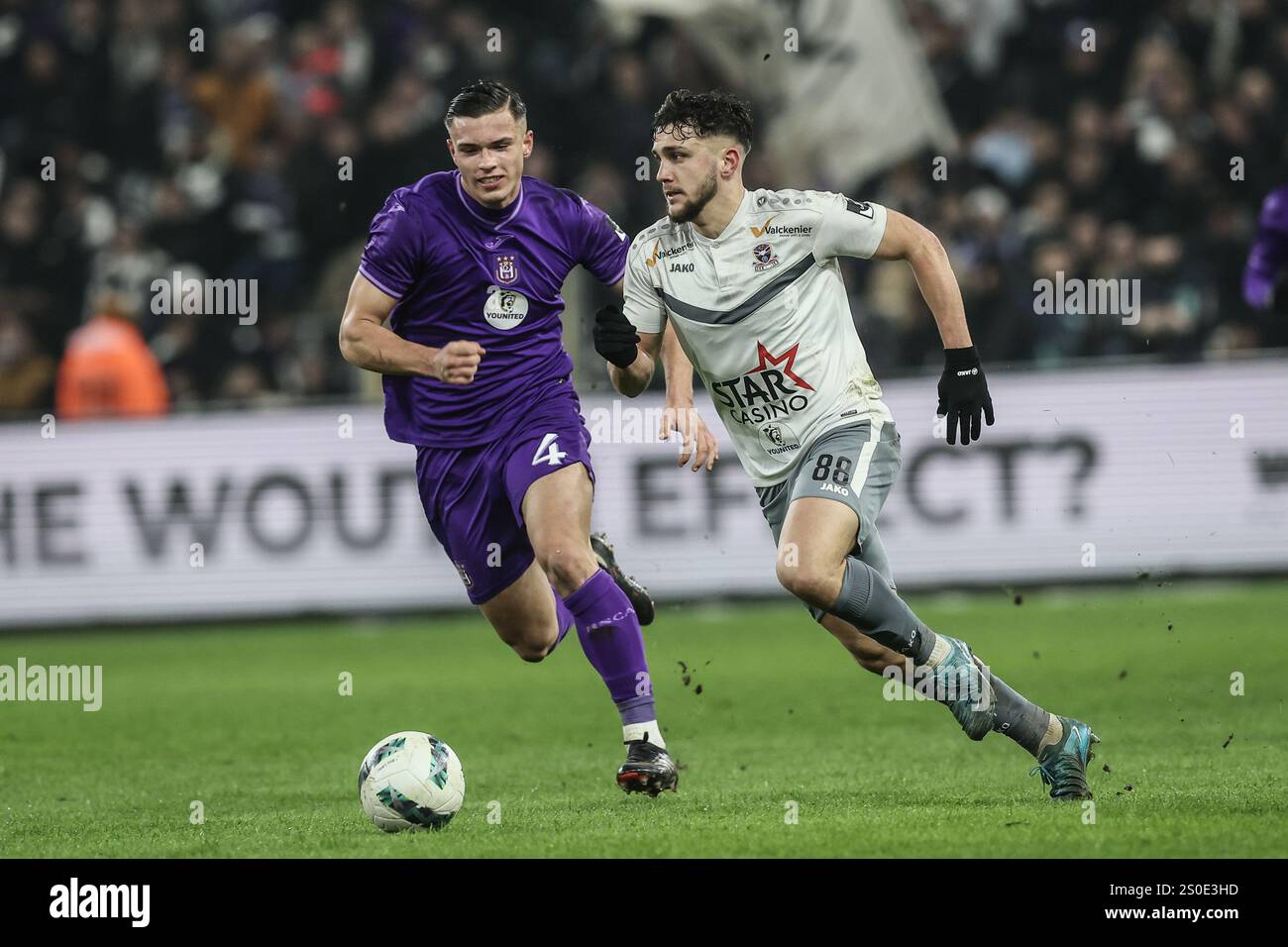 Brussels, Belgium. 27th Dec, 2024. Anderlecht's Jan-Carlo Simic and Dender's Michel Ferraro ...