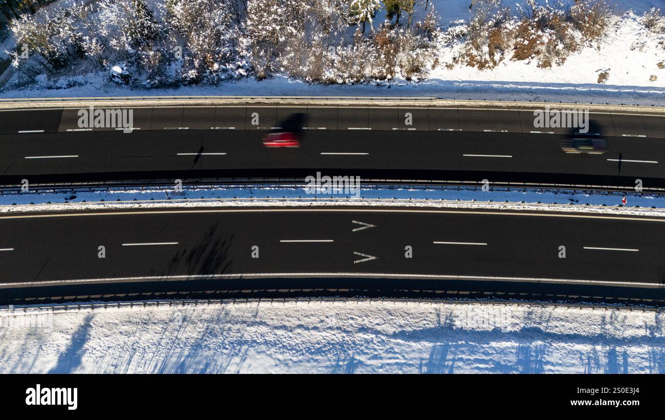 Aerial View of Vehicles on a Snowy Winter Highway Stock Photo - Alamy