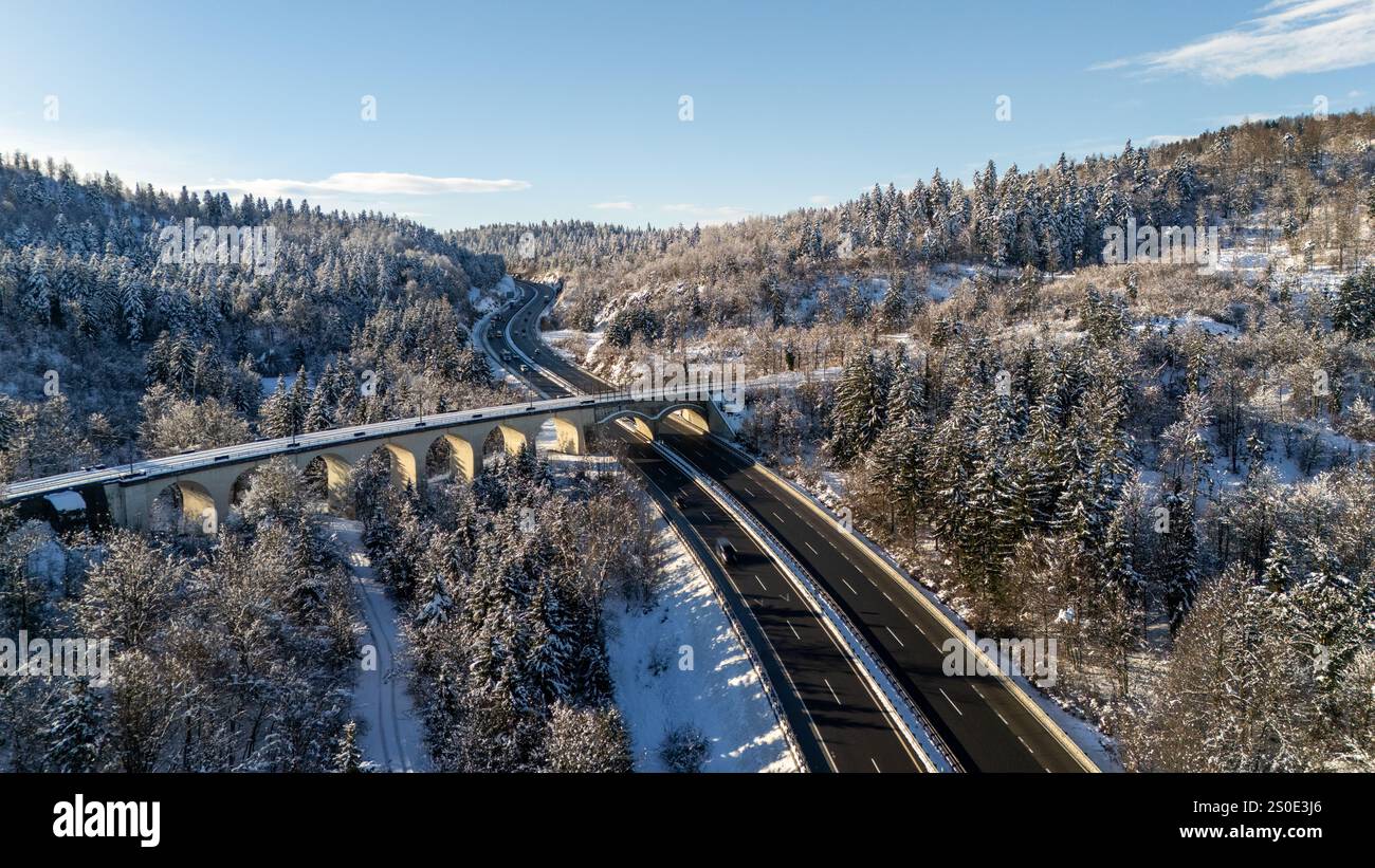 Majestic Winter Highway with Elevated Bridge in Snowy Forest Stock ...