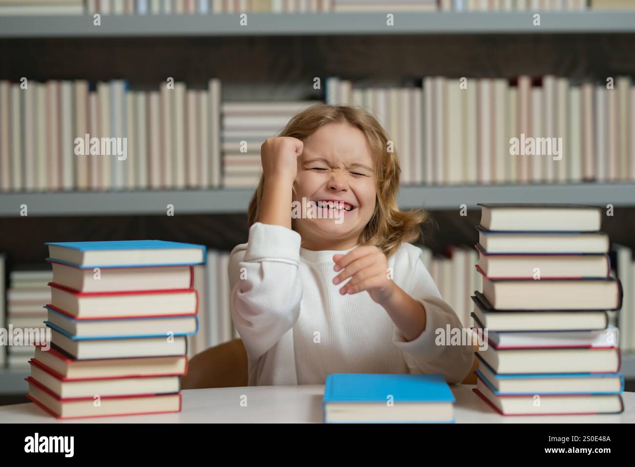School and education concept. Child boy doing homework on desk in ...
