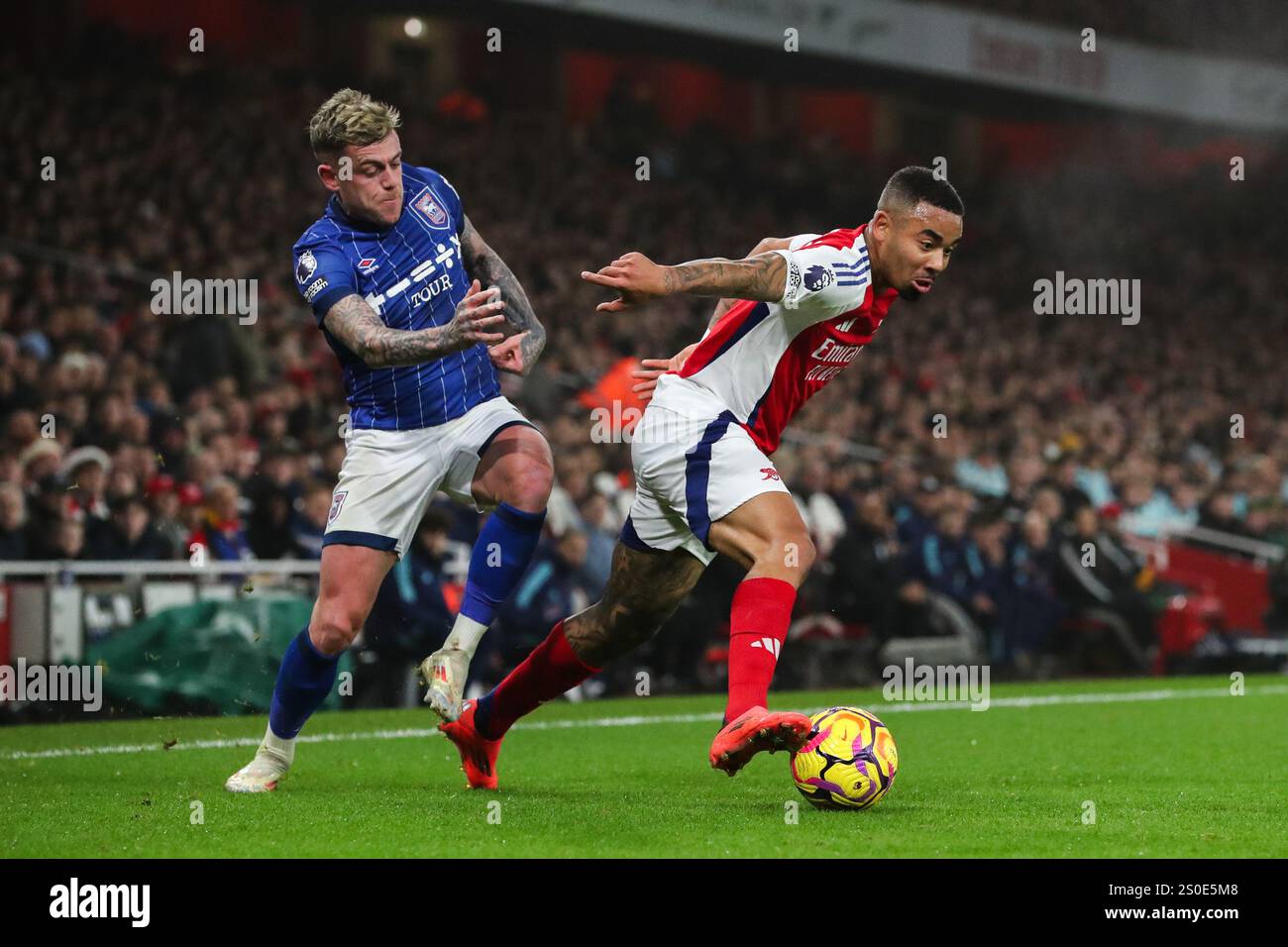 Gabriel Jesus of Arsenal gets the better of Sammie Szmodics of Ipswich Town during the Premier ...