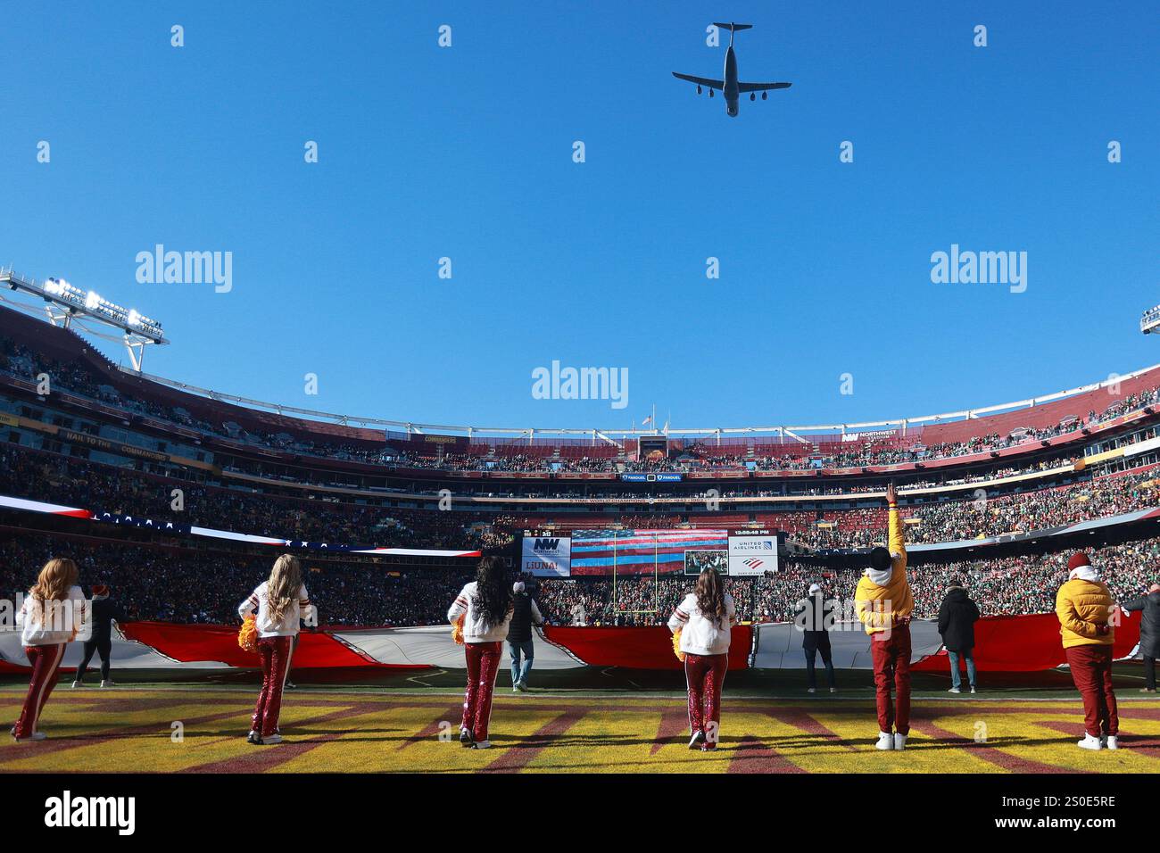 A flyover commences before an NFL football game between the ...
