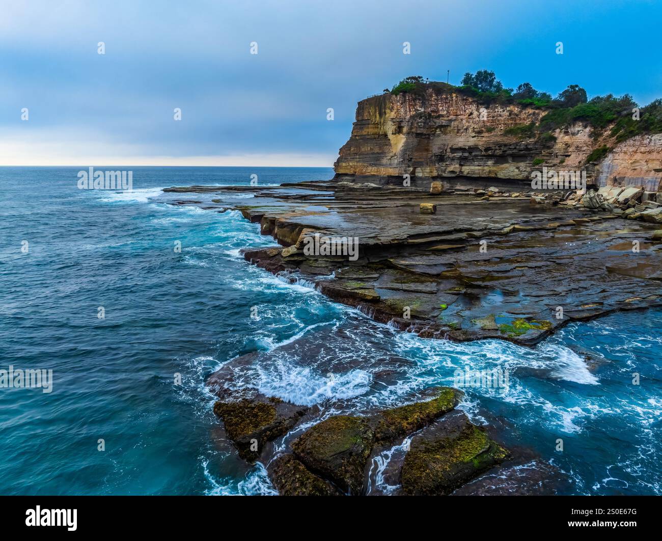 Aerial sunrise seascape with thick fog cloud at The Skillion in Terrigal, NSW, Australia Stock ...