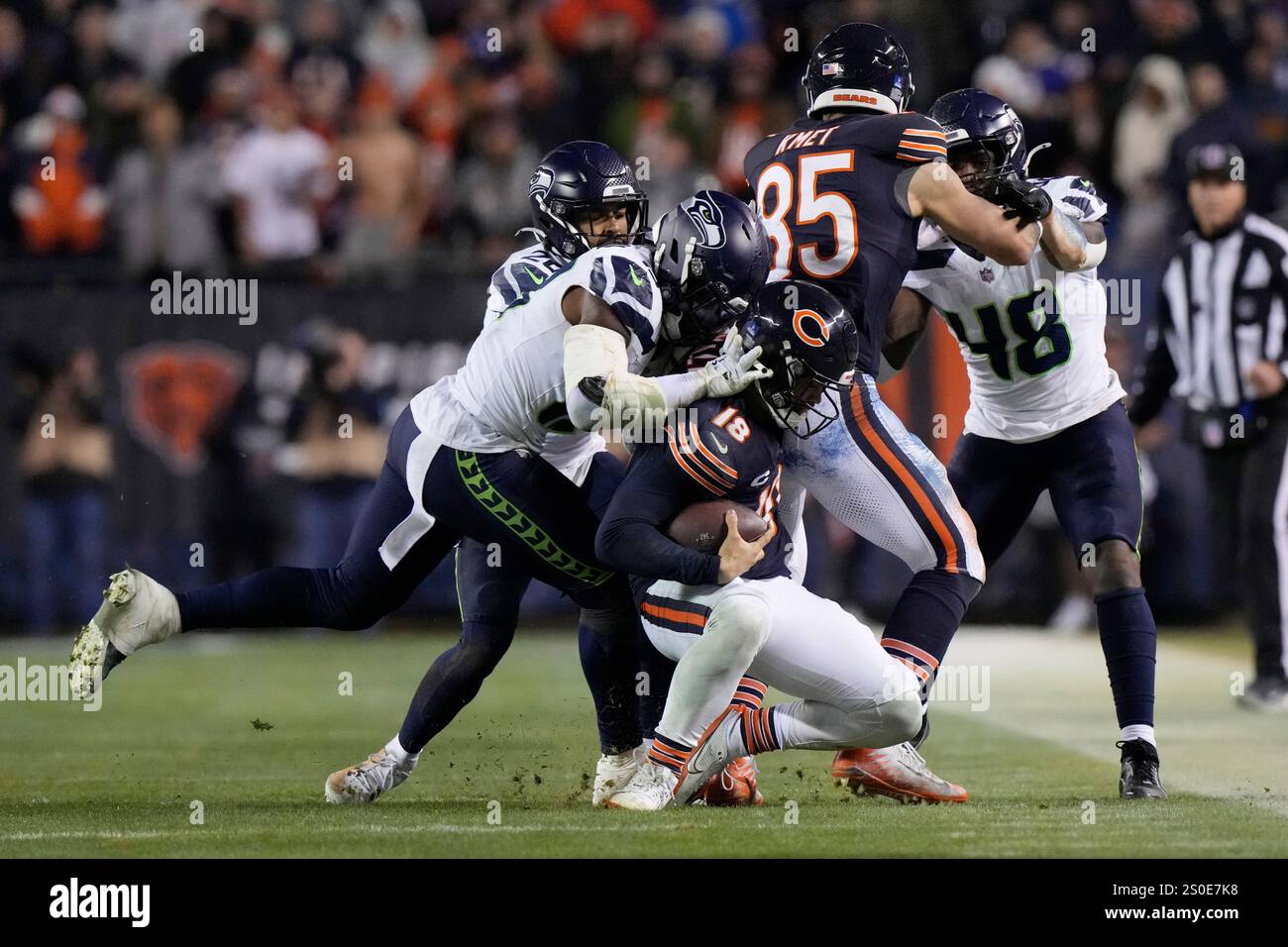 Chicago Bears quarterback Caleb Williams (18) is tackled by Seattle ...